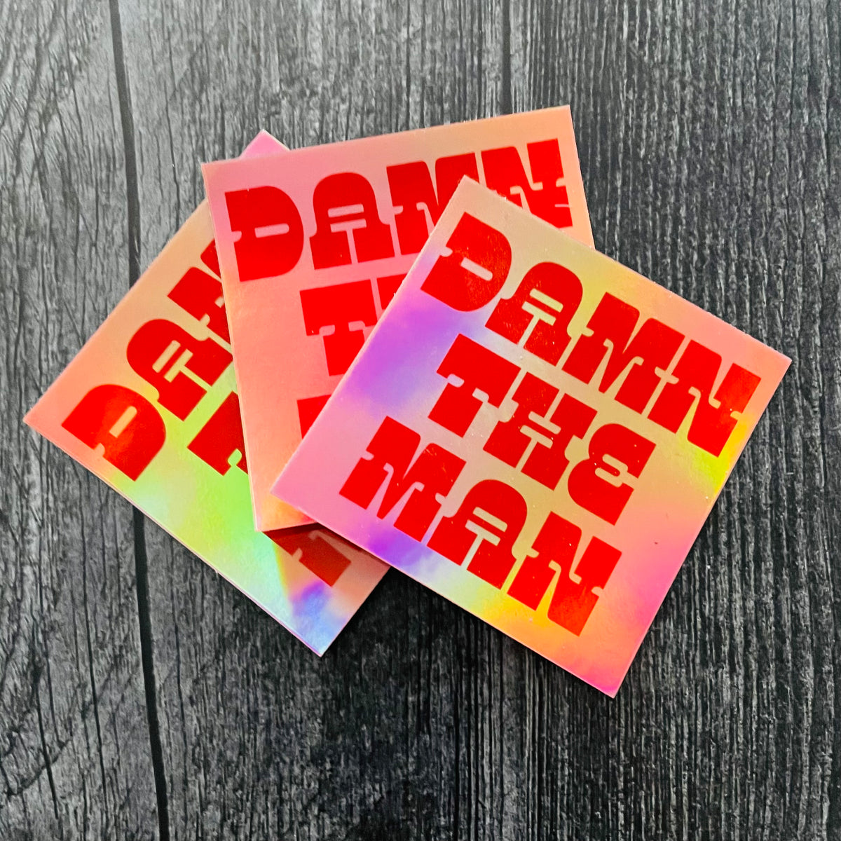 Damn the Man Holographic Sticker – The Silver Spider